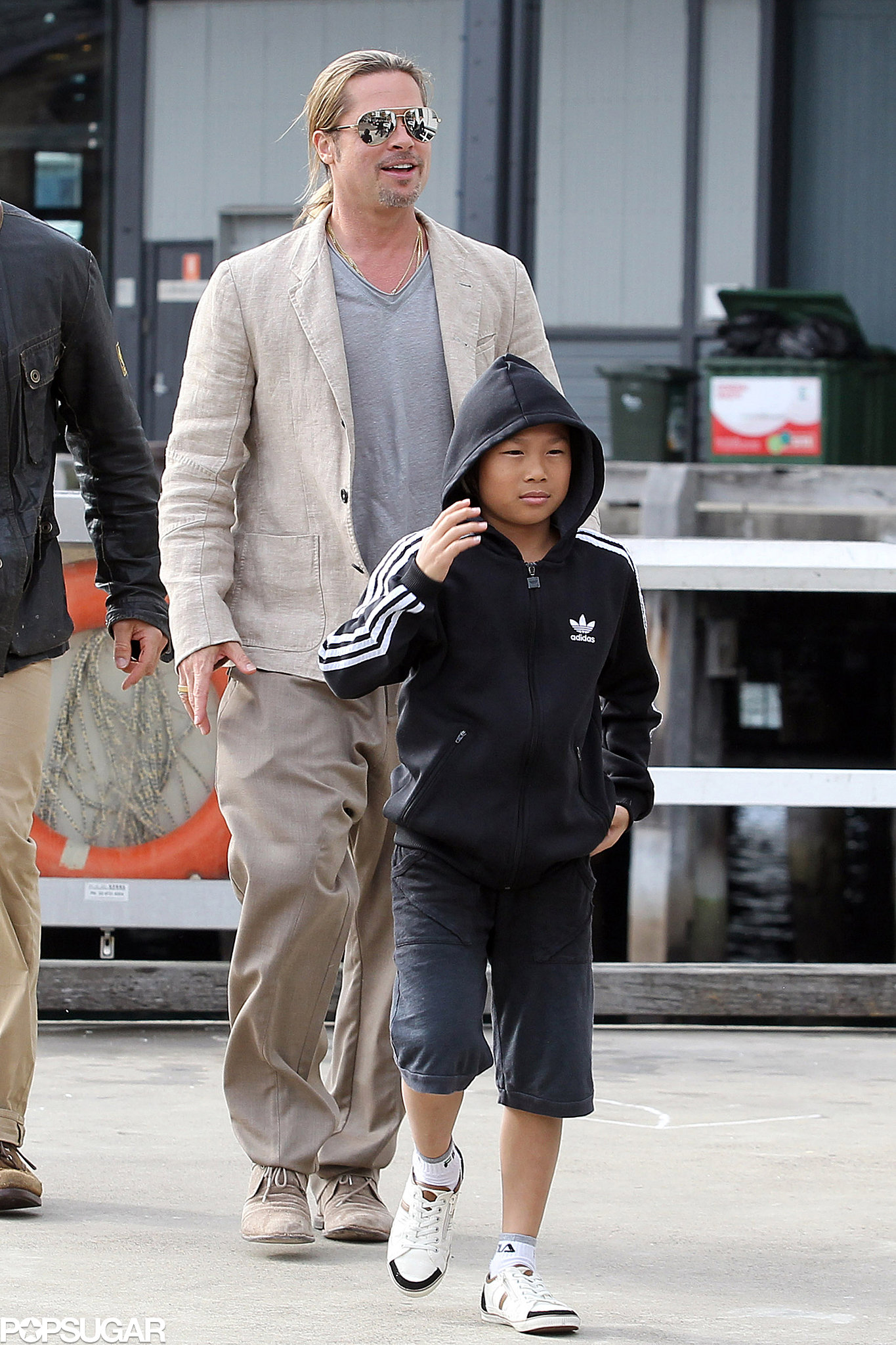 Brad Pitt and Pax Jolie-Pitt walked together on a dock. | Brad Pitt and ...