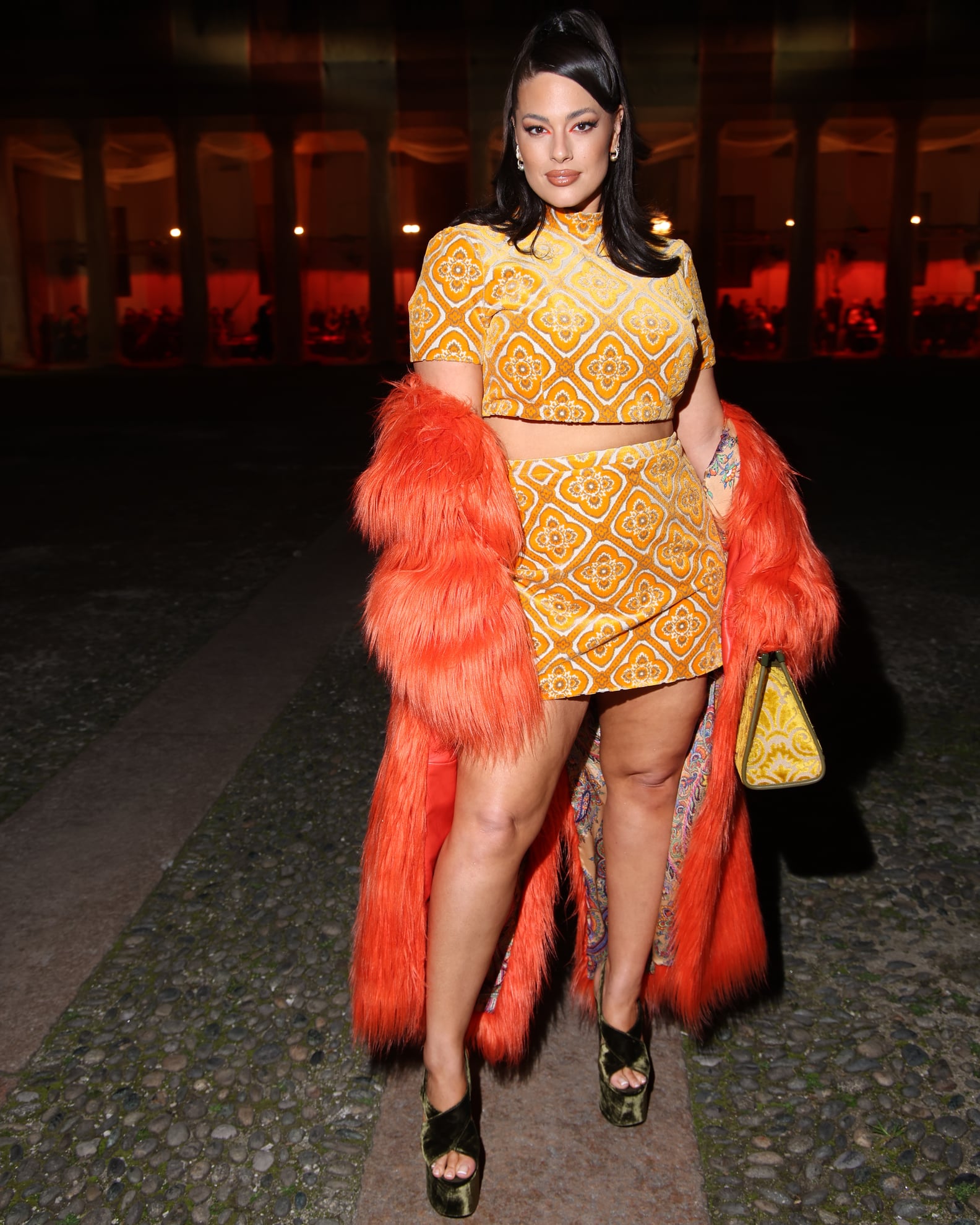 Ashley Graham Wears an Orange Miniskirt and Fur Coat at Etro | PS Fashion