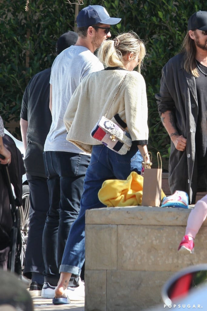 Miley Cyrus Chanel Overalls and Slides | POPSUGAR Fashion