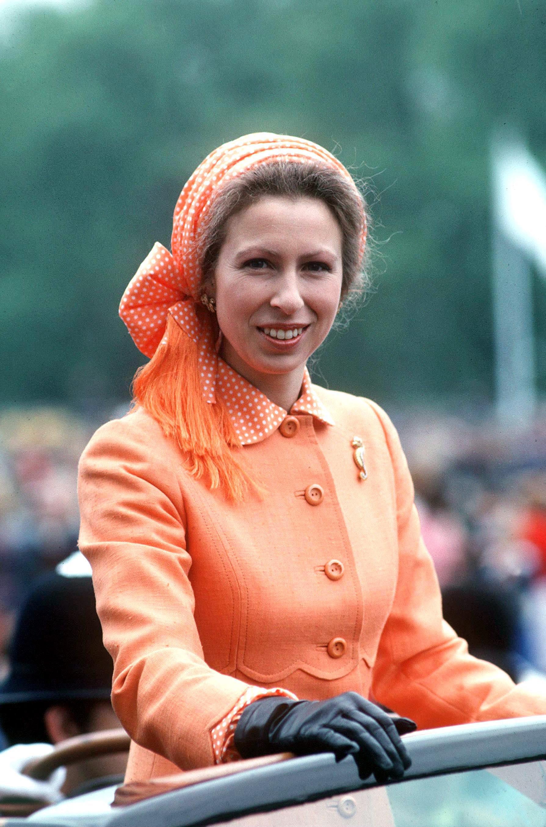 Princess Anne wore a tangerine polka dot scarf/hat combo at a charity ...