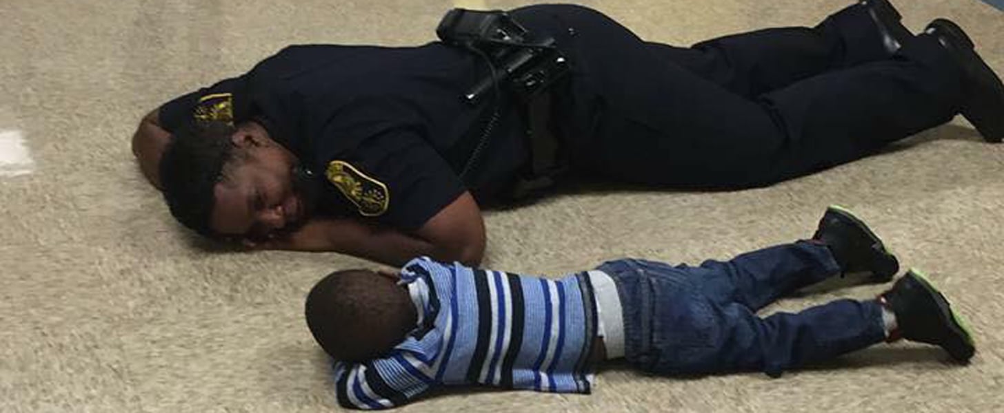 Photo of Police Officer Lying Down With Little Boy | PS Family