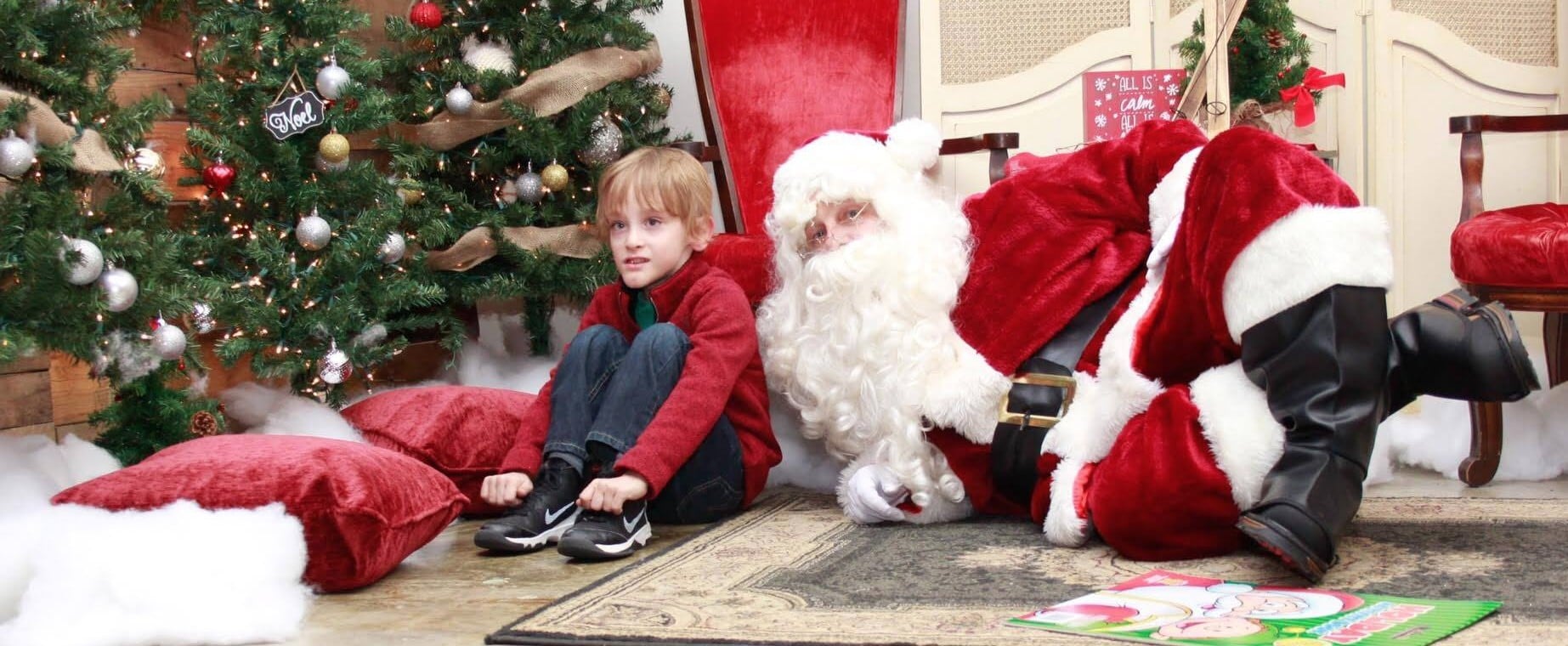 Sensory-Friendly Santa Takes Photo on the Ground With Child | PS Family