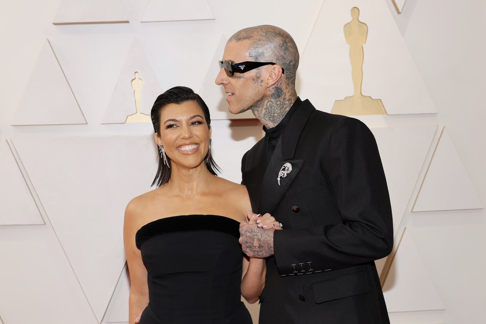 Kourtney Kardashian and Travis Barker at the 2022 Oscars | PS Celebrity
