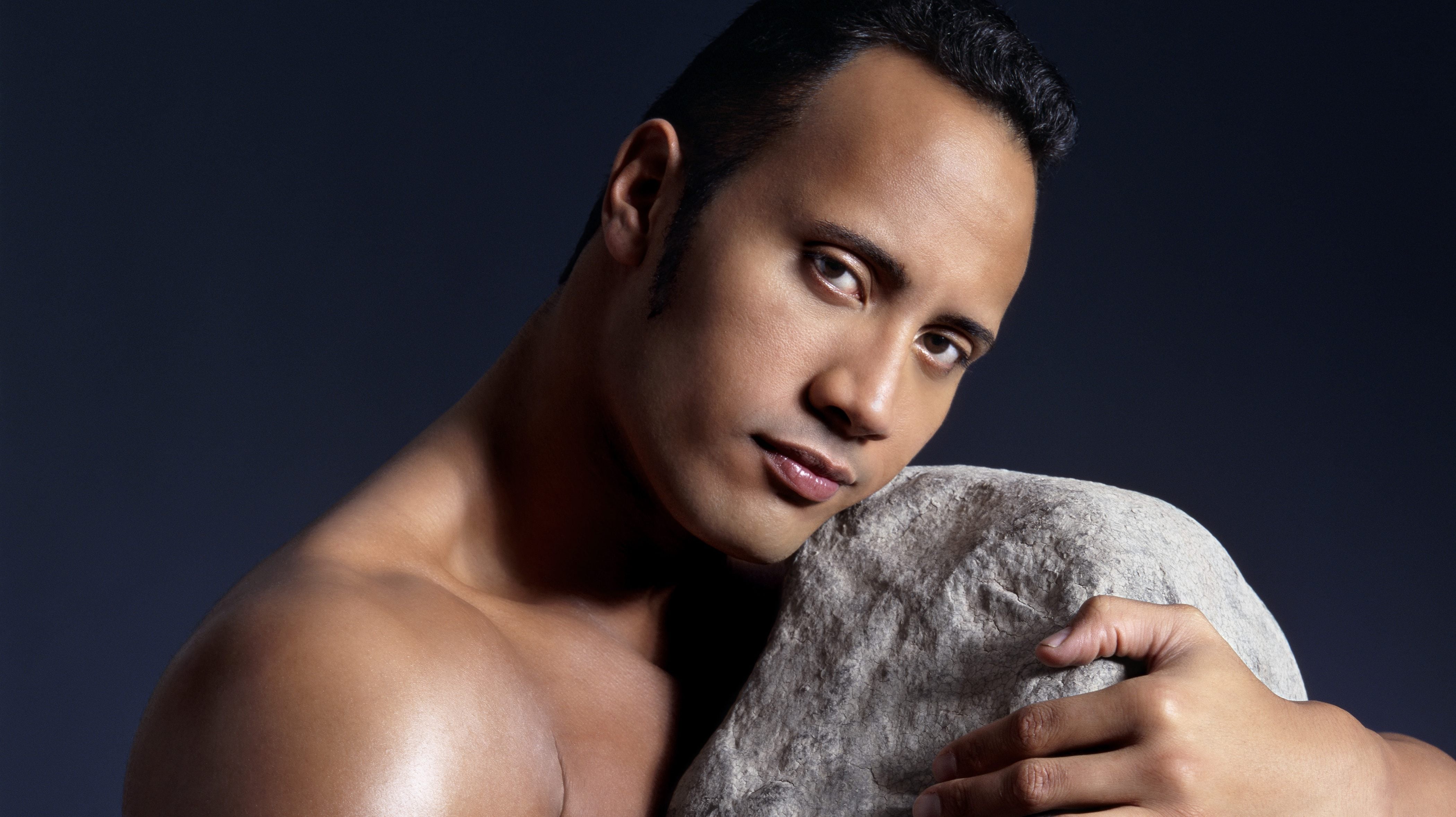 Dwayne Johnson Posing With a Rock Photos | PS Celebrity