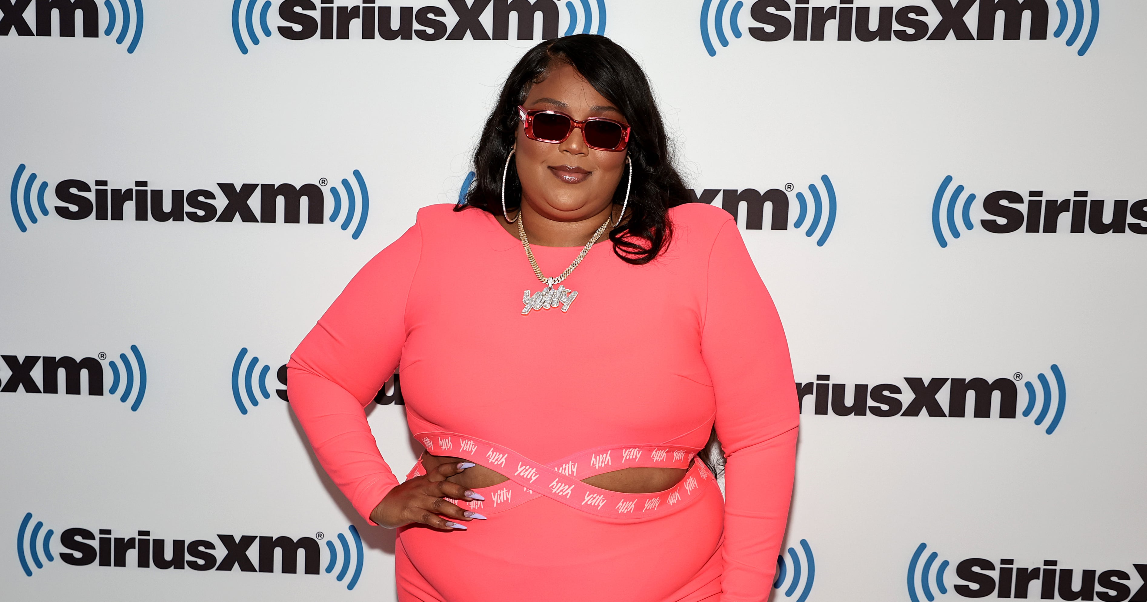 Lizzo Visits SiriusXM in a Pink Cutout Yitty Minidress | PS Fashion