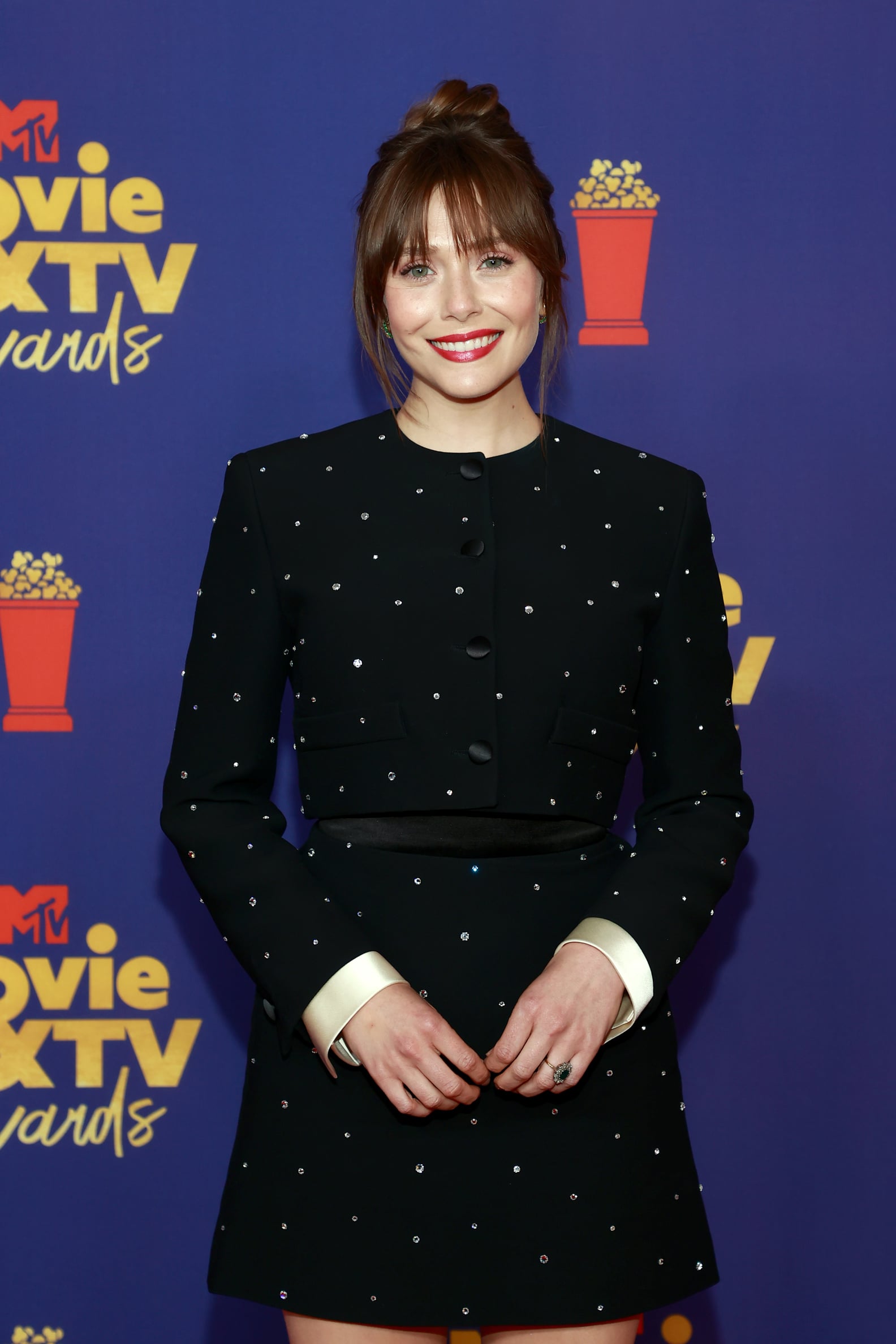 Elizabeth Olsen Debuted Curtain Bangs and Brown Hair Color | PS Beauty