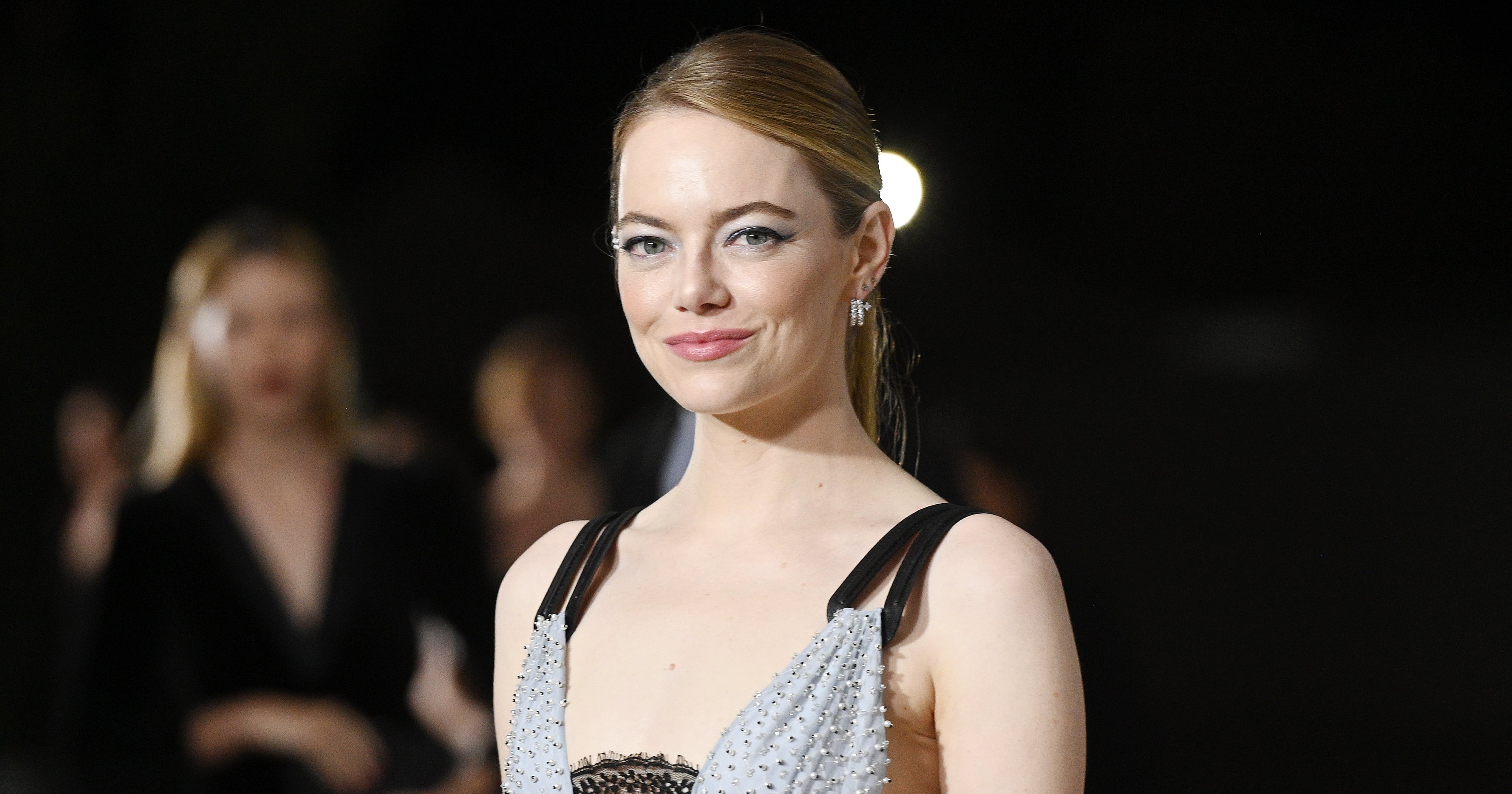 Emma Stone's Curtain Bangs at Louis Vuitton Cruise Show | POPSUGAR Beauty