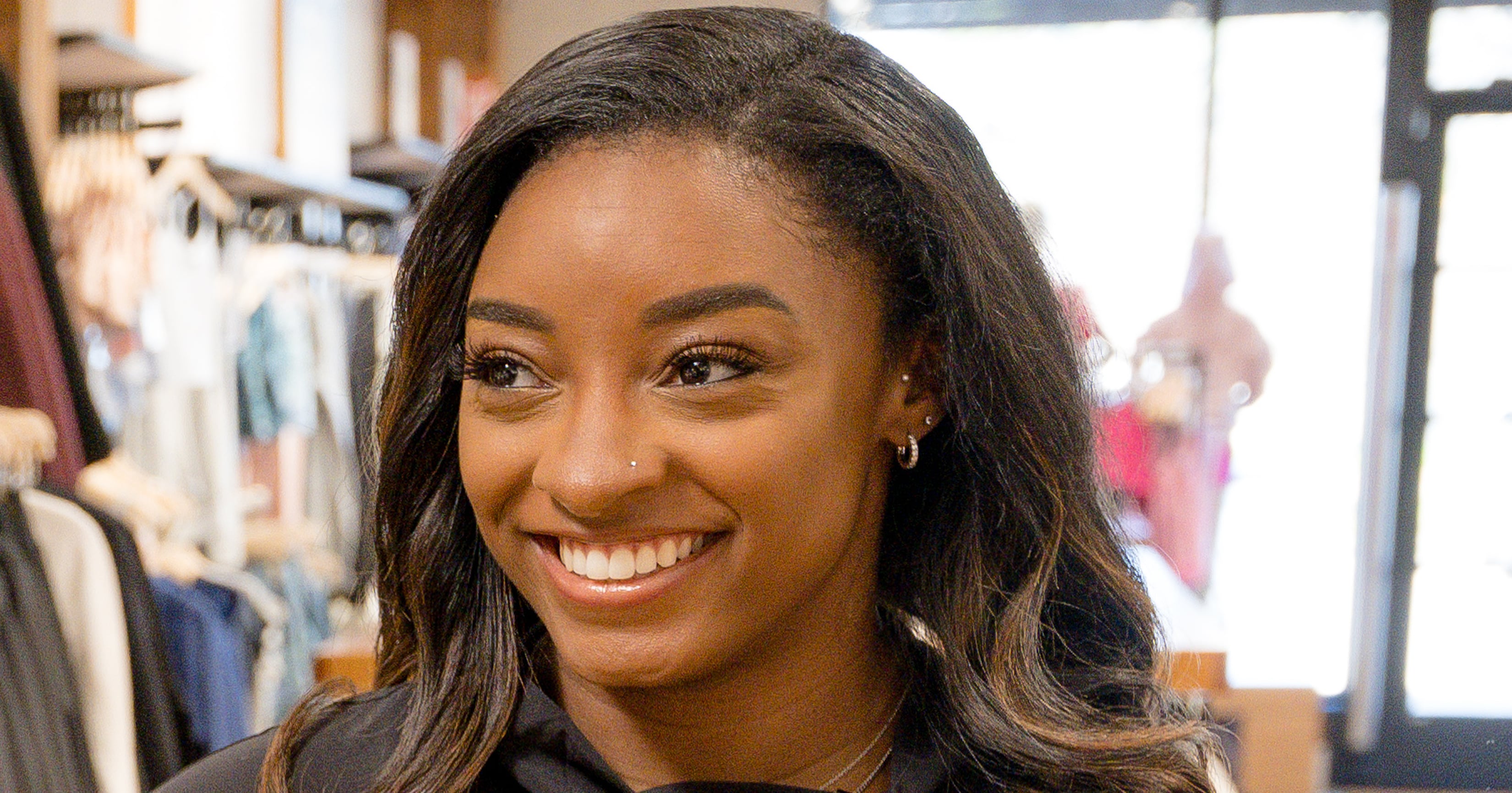 Simone Biles's Orange Cutout Midi Dress With Jonathan Owens | POPSUGAR ...