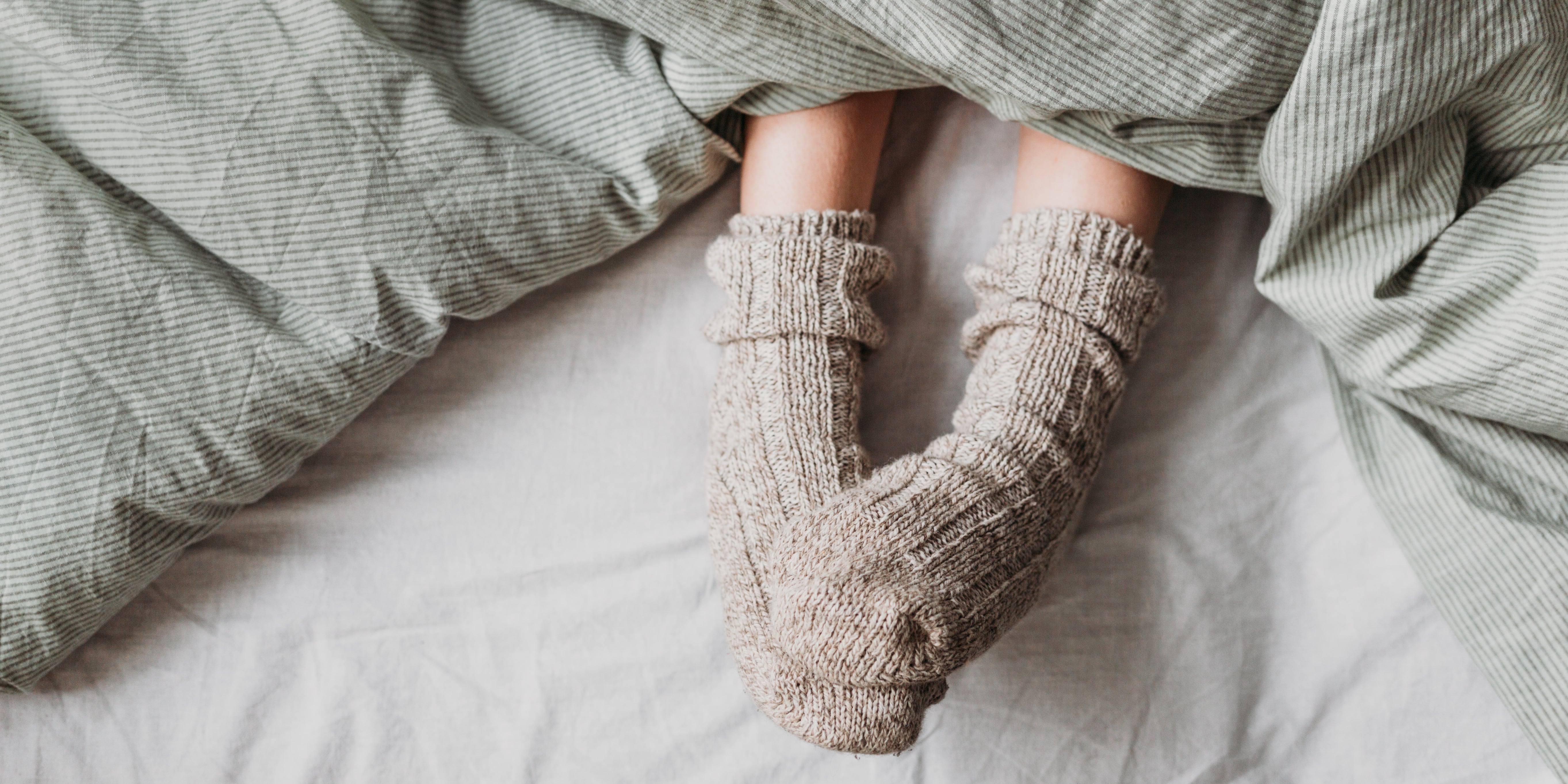 Is Wearing Socks to Bed OK? Experts Explain | PS Health