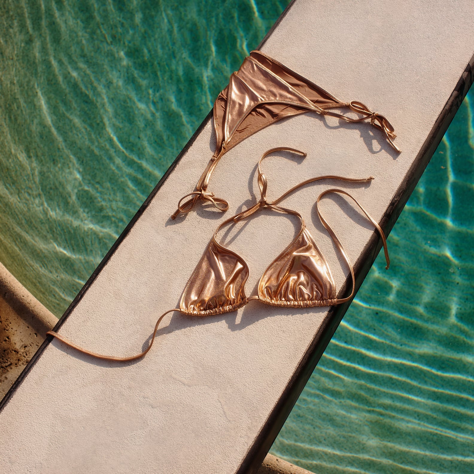 See Kim Kardashian Model the Skims Metallic Swim Collection | PS Fashion