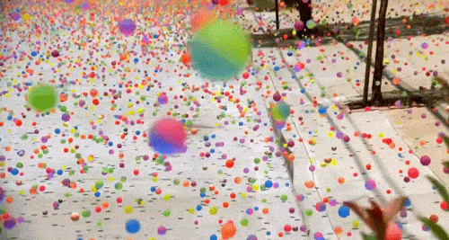 35. A thousand multicolored bouncy balls coming down a steep hill ...
