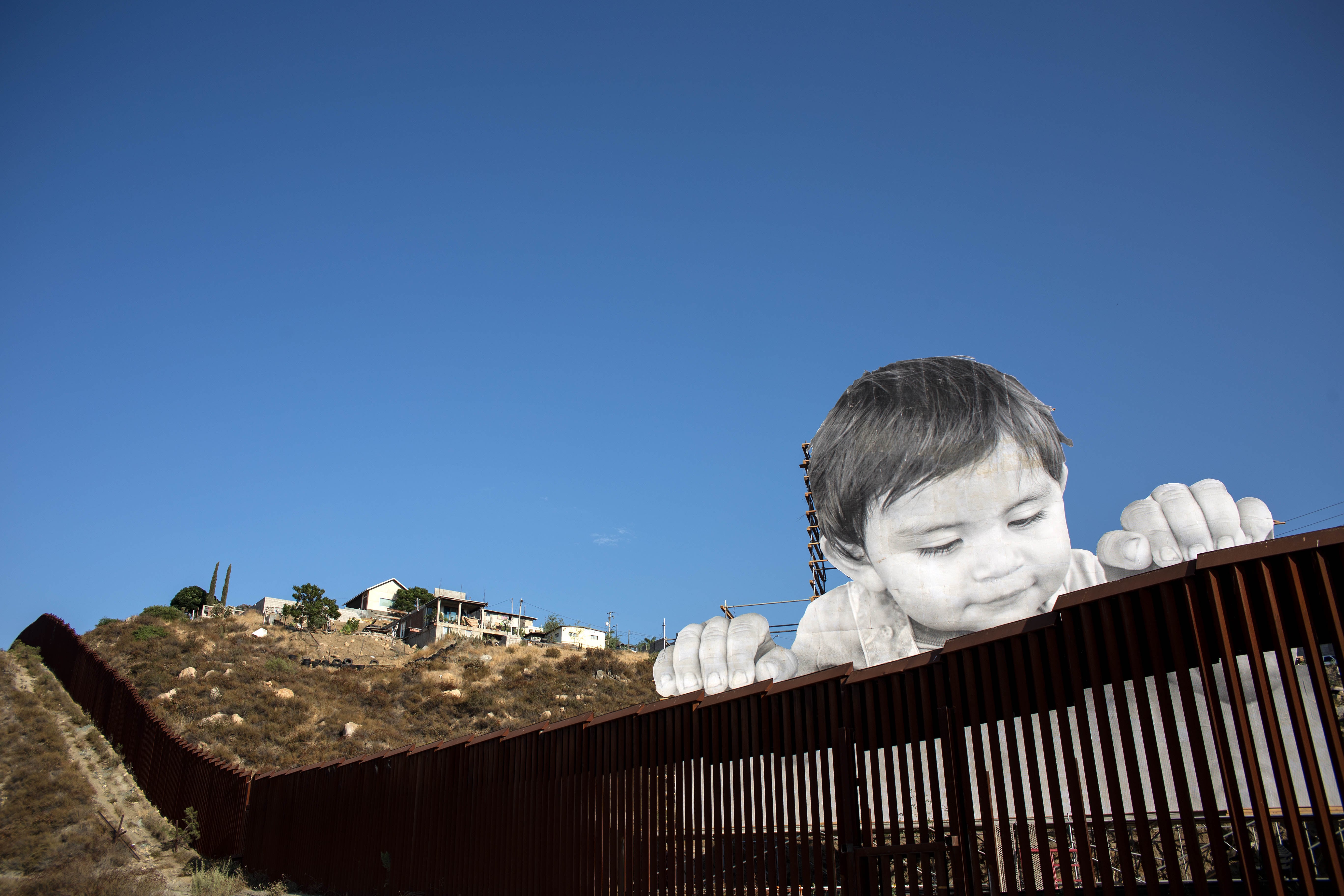 Mexico Border Wall Art Installation of a Child by JR | PS News