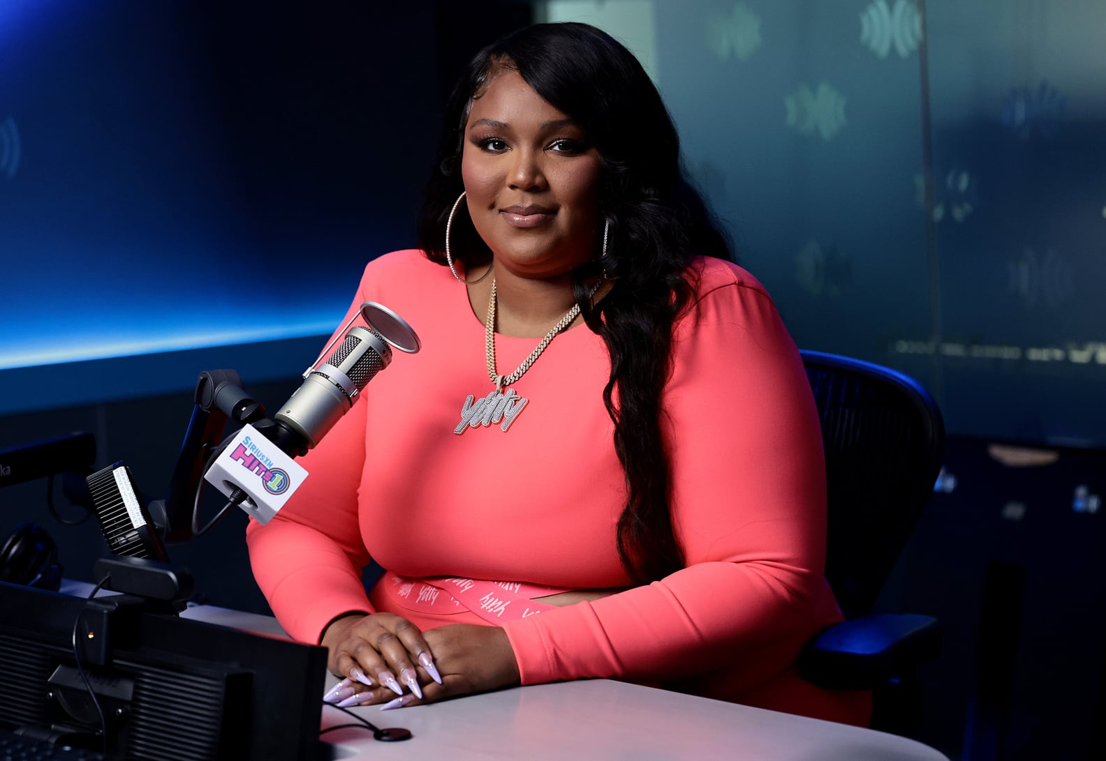 Lizzo Visits SiriusXM in a Pink Cutout Yitty Minidress | PS Fashion
