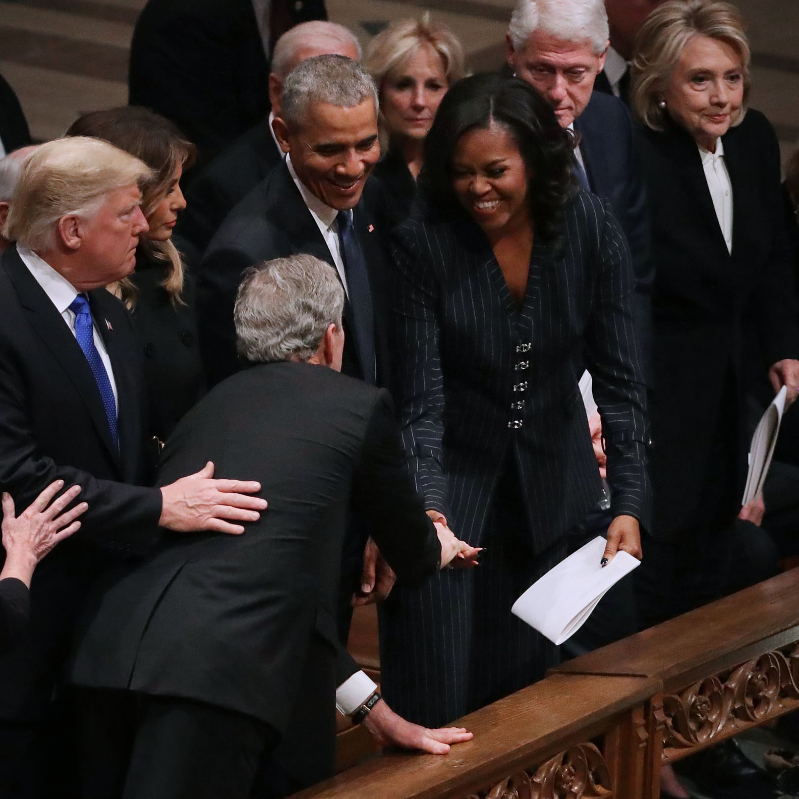 George W Bush Gives Michelle Obama Candy at Father's Funeral | PS News