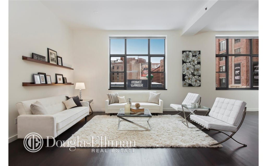 An open-concept floor plan and soaring 13-foot ceilings make the ...
