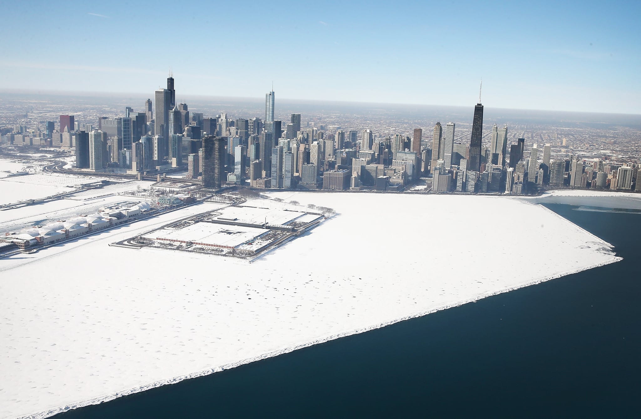 Freezing temperatures have left the Chicago shoreline covered in snow ...