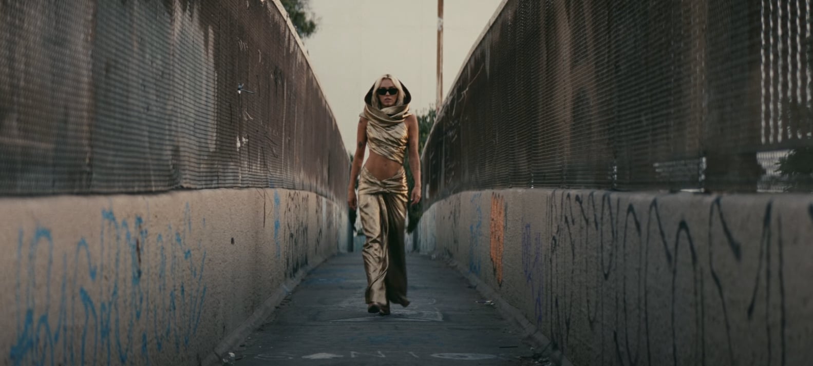 Miley Cyrus Wears Gold Cutout Dress in "Flowers" Music Video | POPSUGAR ...