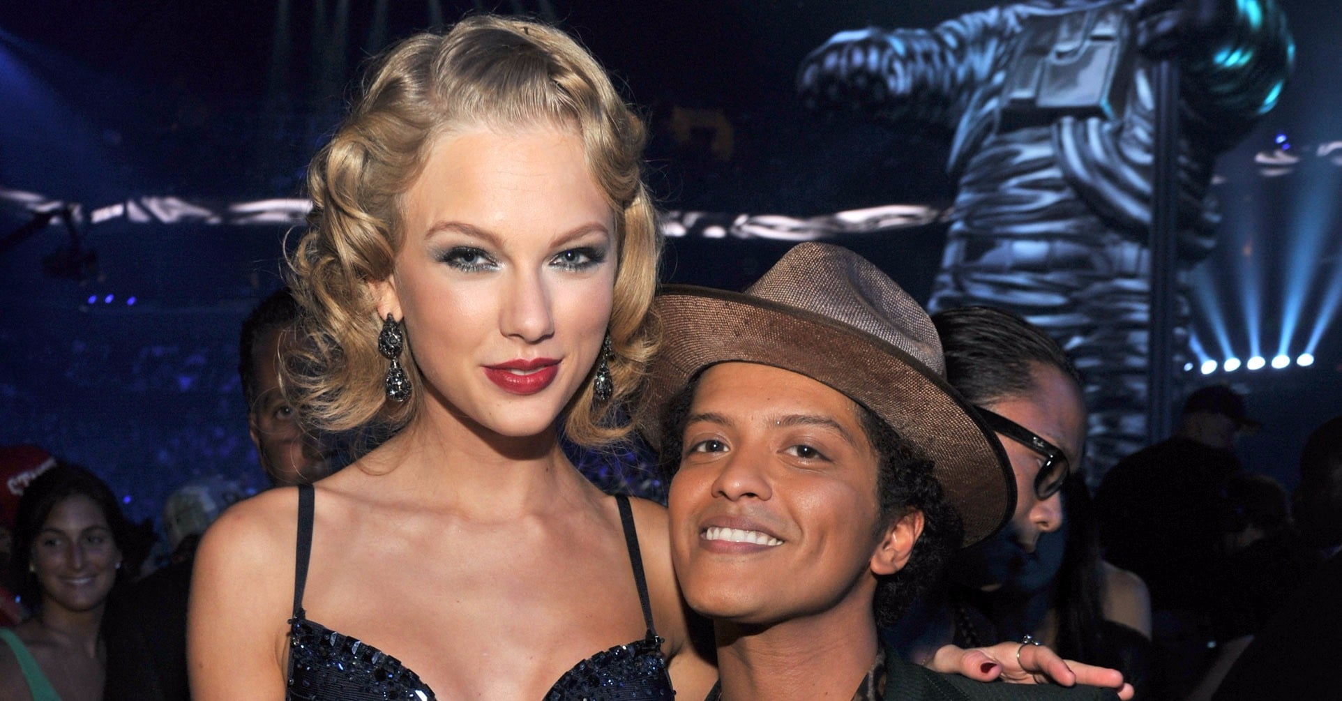 Bruno Mars Standing Next To Taylor Swift