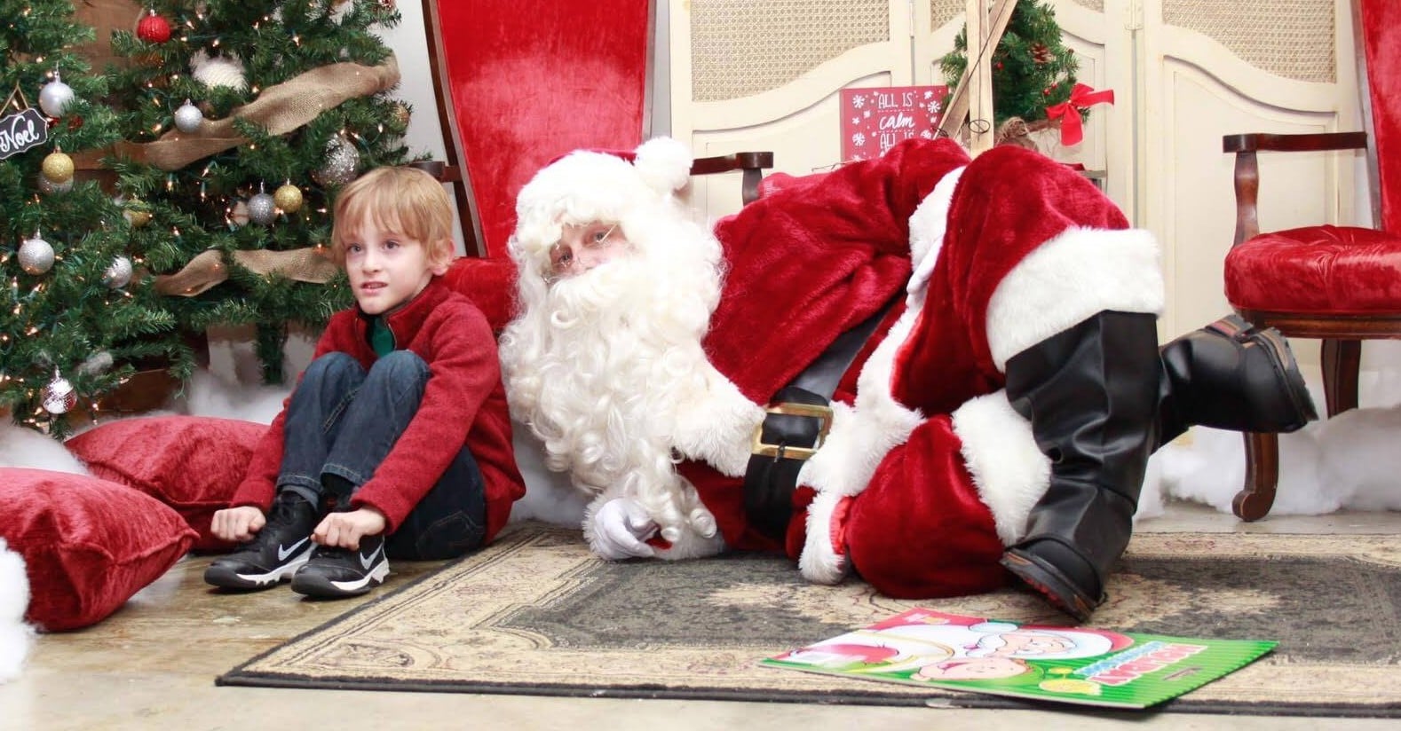 Sensory-Friendly Santa Takes Photo on the Ground With Child | PS Family