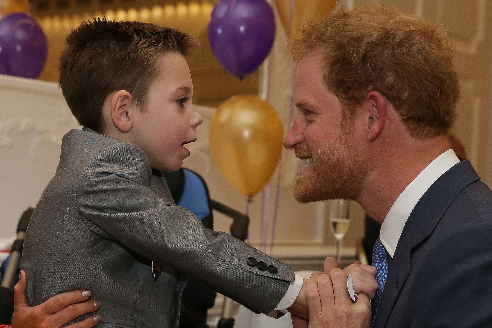 The Cutest Pictures of Prince Harry With Kids | PS Celebrity