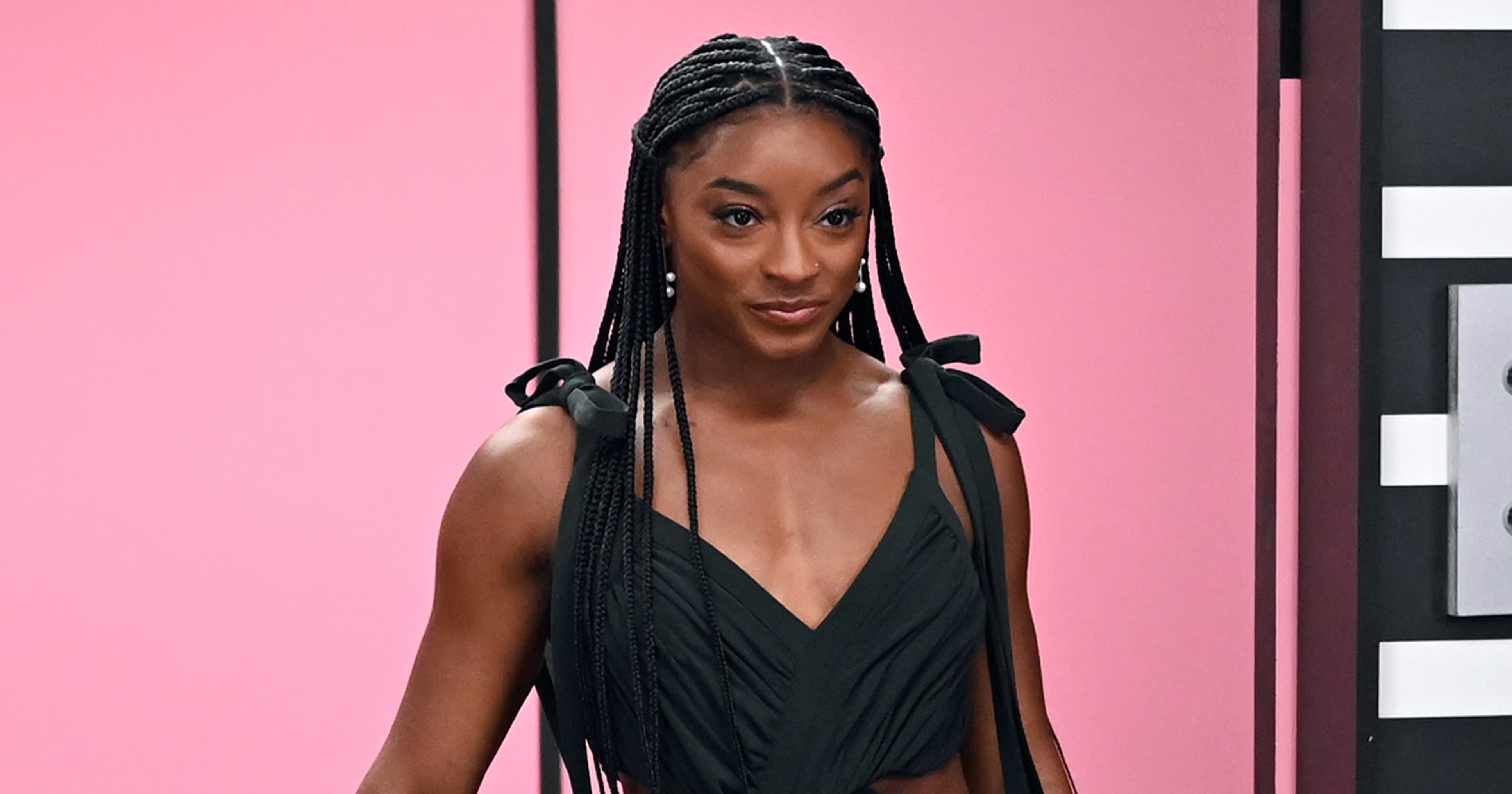 Simone Biles in Flannel, Shorts, and White Knee-High Boots | PS Fashion