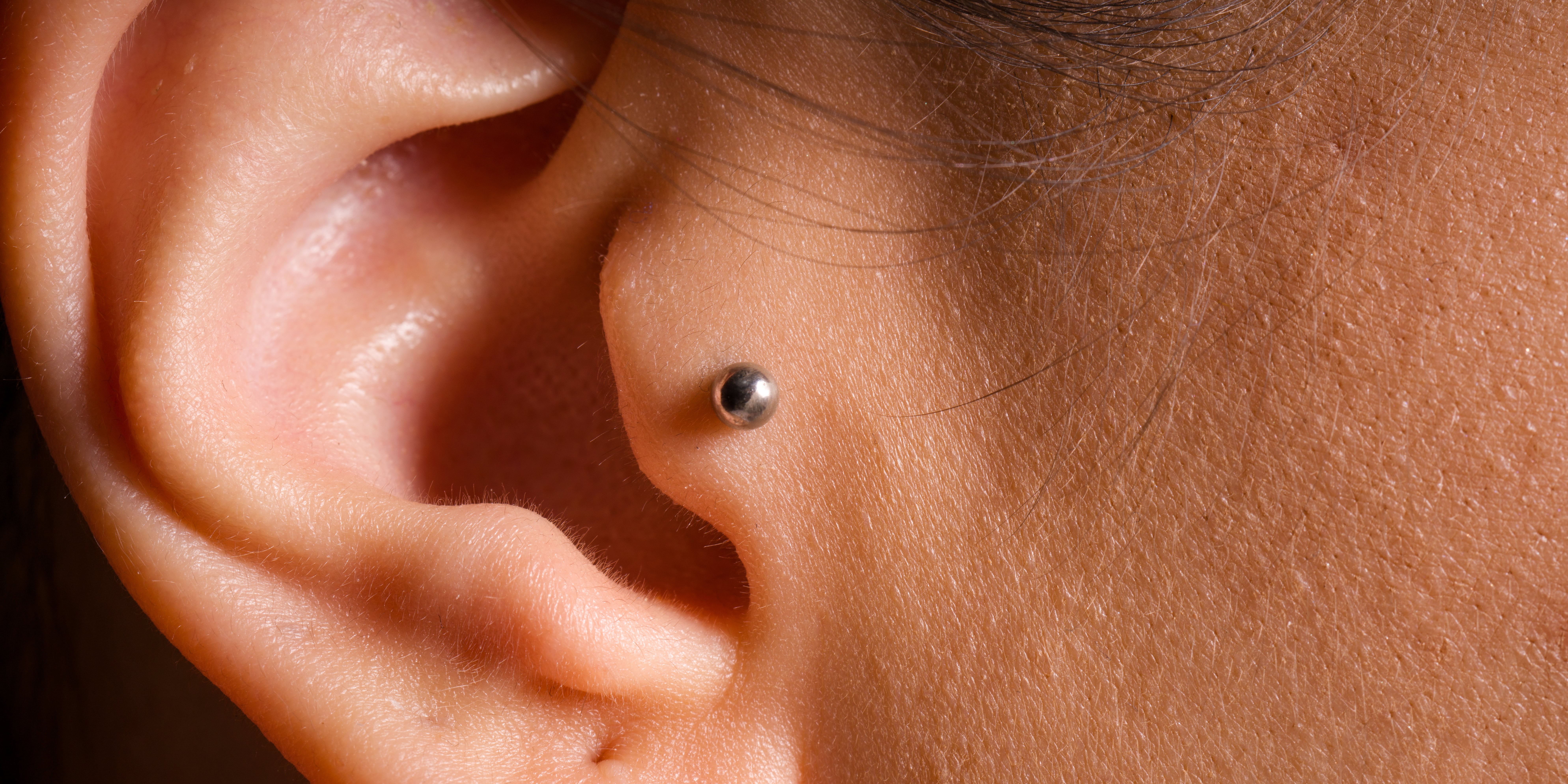 dermal tragus piercing