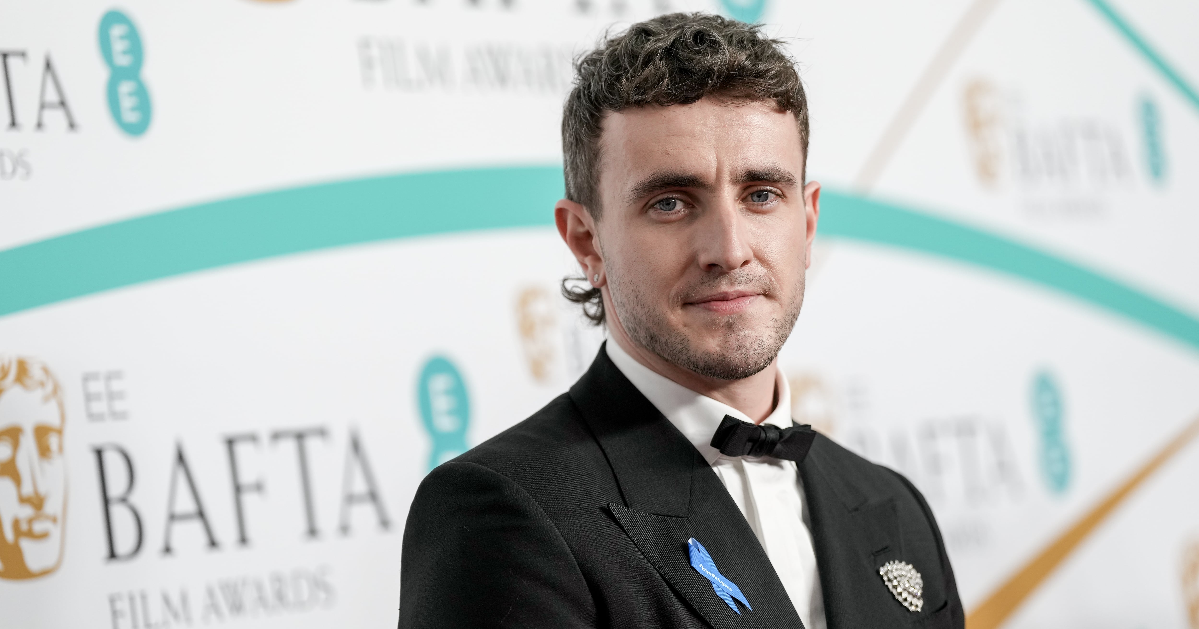 Why Celebrities Wore Blue Ribbons at the 2023 BAFTAs | PS Fashion